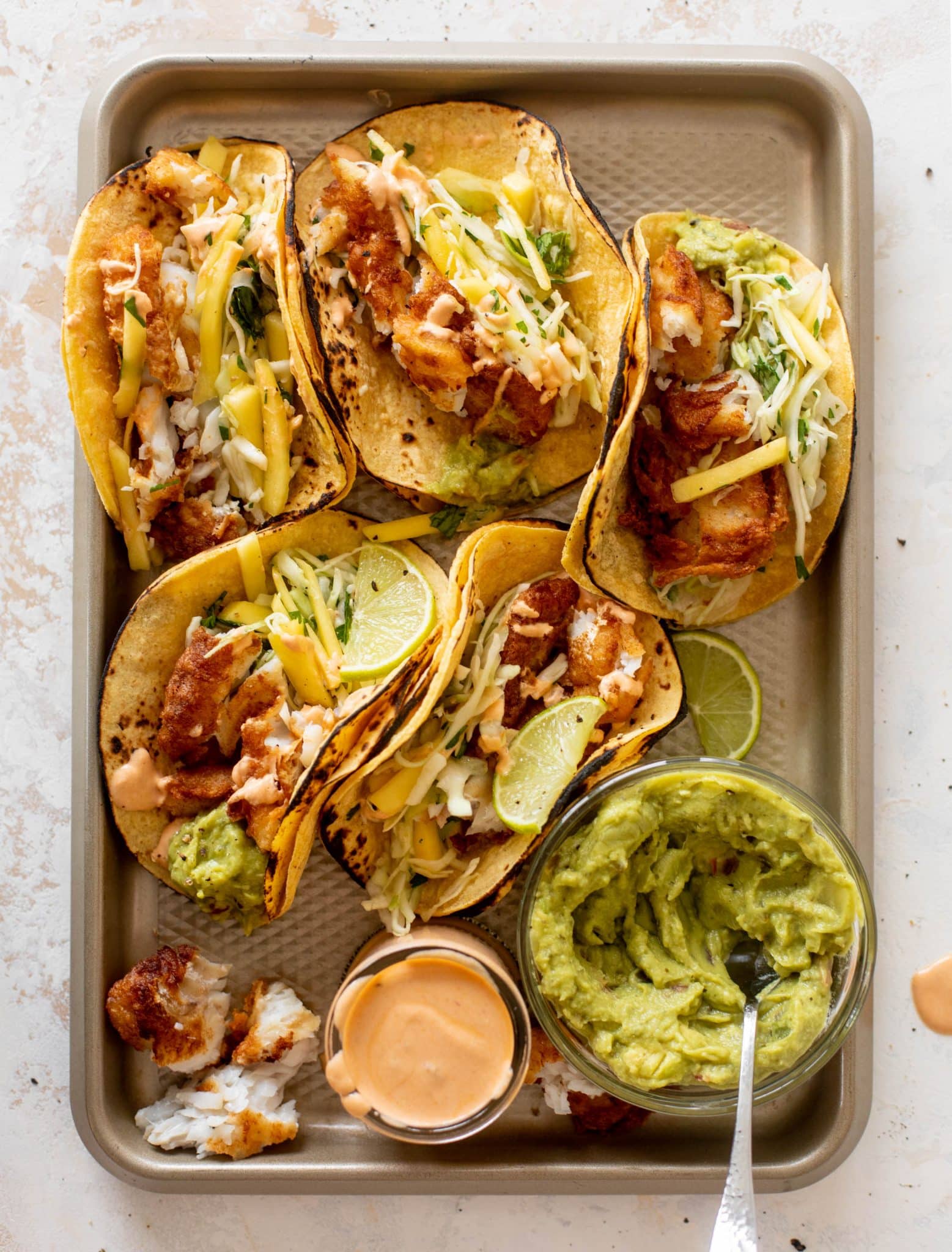 Beer Battered Fish Tacos with Mango Slaw and Chipotle Crema